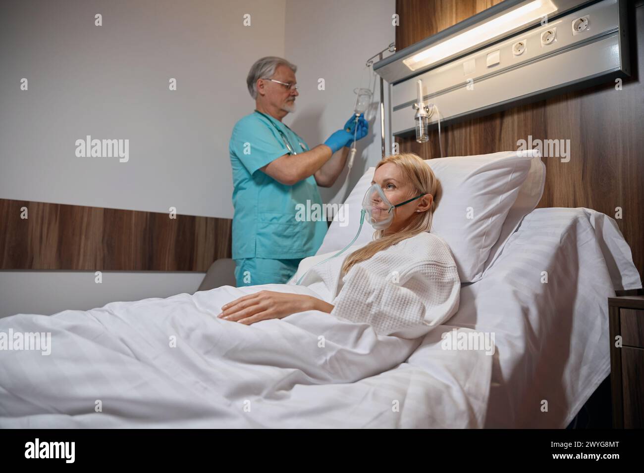 Doctor preparing iv patient hi-res stock photography and images - Alamy