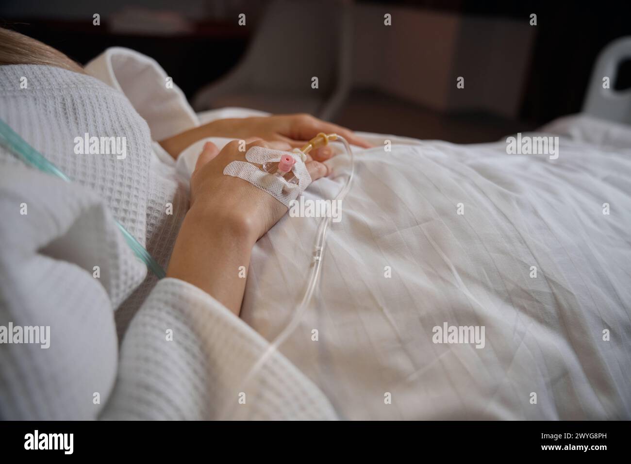 Inpatient getting IV therapy in healthcare facility ward Stock Photo ...