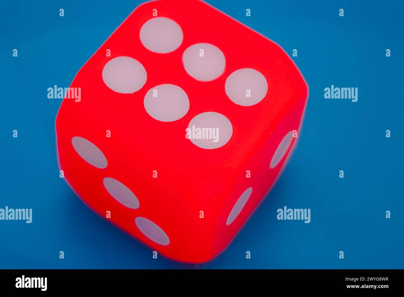 Lucky winner red dice against the blue background showing six Stock ...