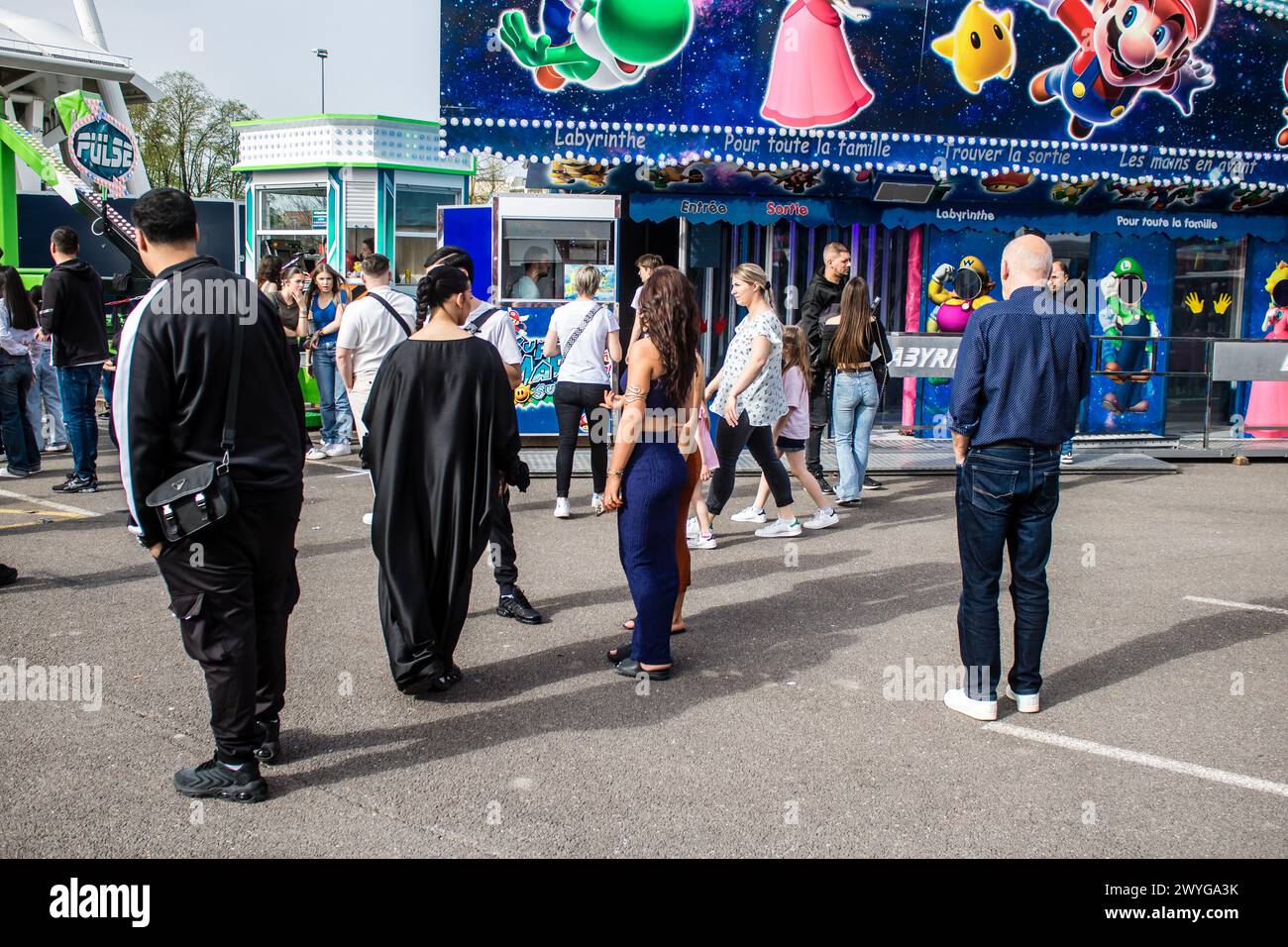 Reims France April 6, 2024 Funfair with its colorful stands located in ...