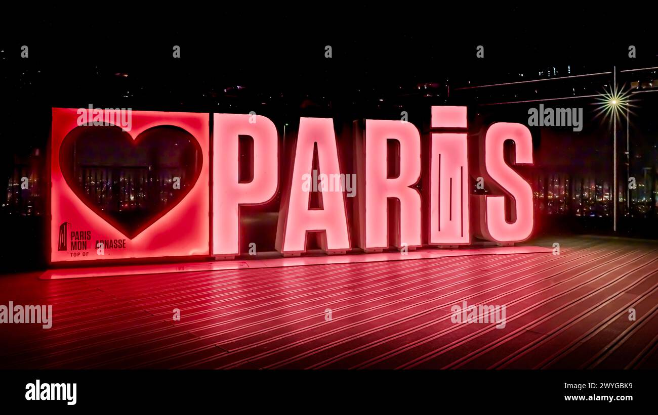 Pink sign declaring love for Paris against city backdrop Stock Photo ...