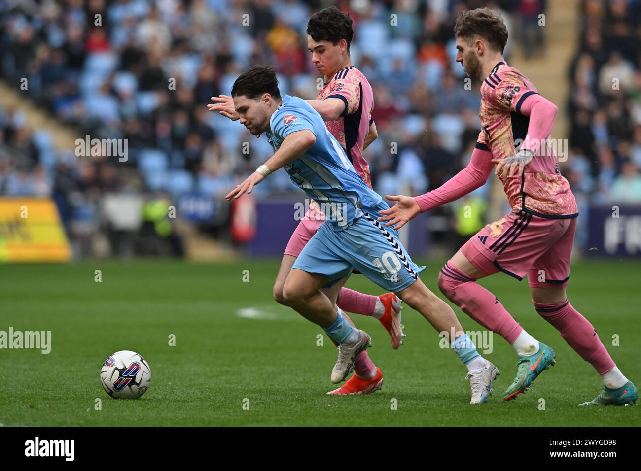 Callum OHare (10 Coventry City) challenged by Archie Gray (22 Leeds ...