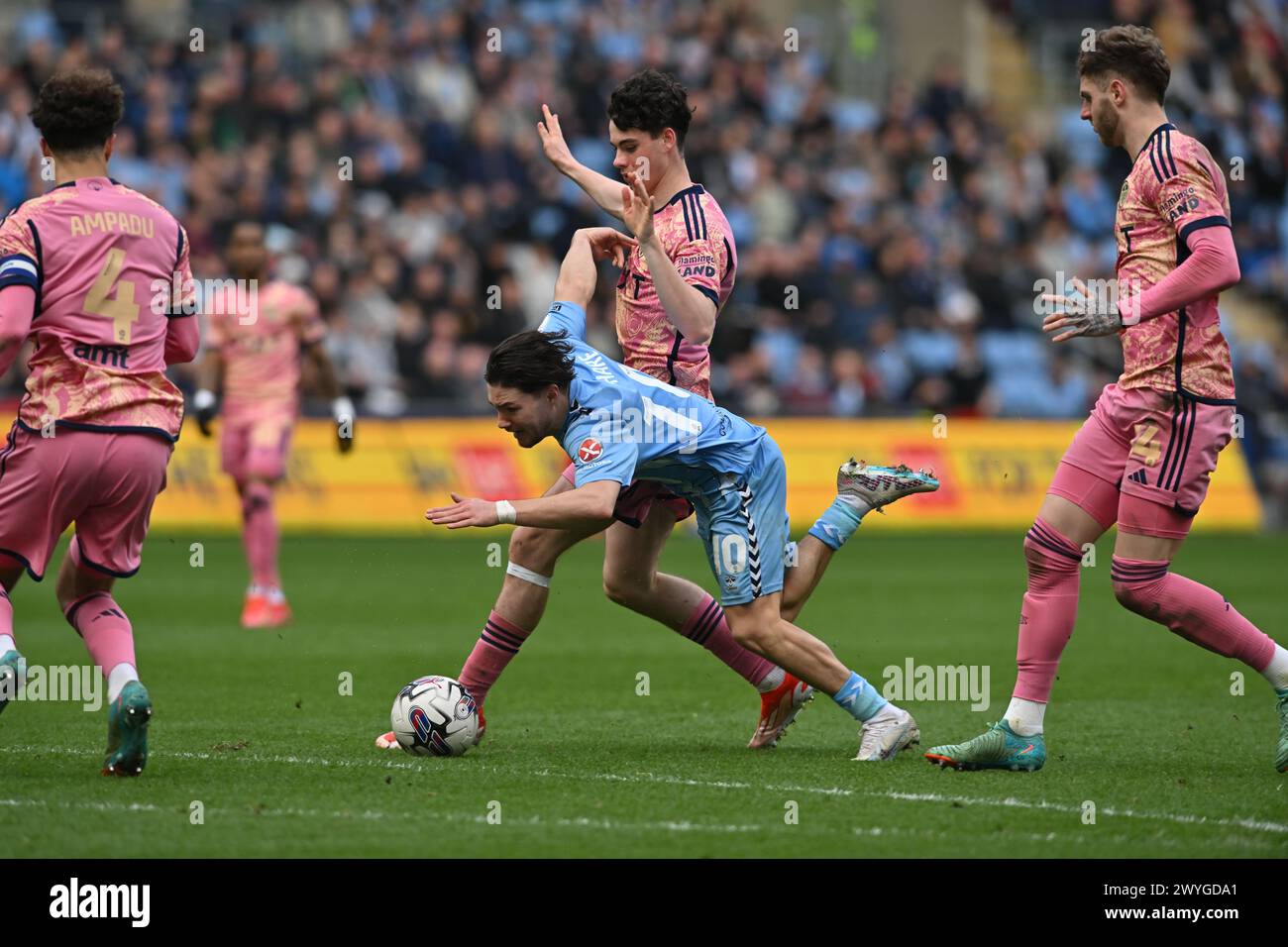 Callum OHare (10 Coventry City) challenged by Archie Gray (22 Leeds ...