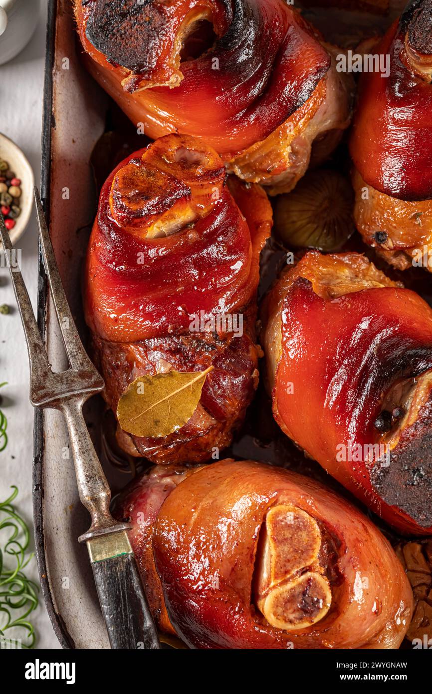 Aromatic and fat pork knuckle made with spices. Baked ham hock with ...