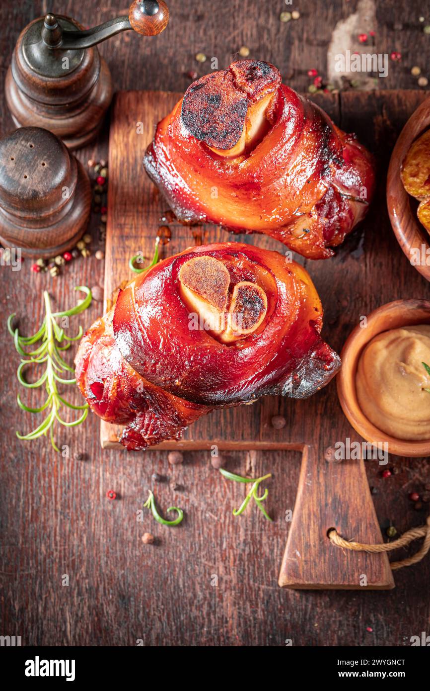 Hot and cripsy roasted ham hock served with potatoes and pickled ...