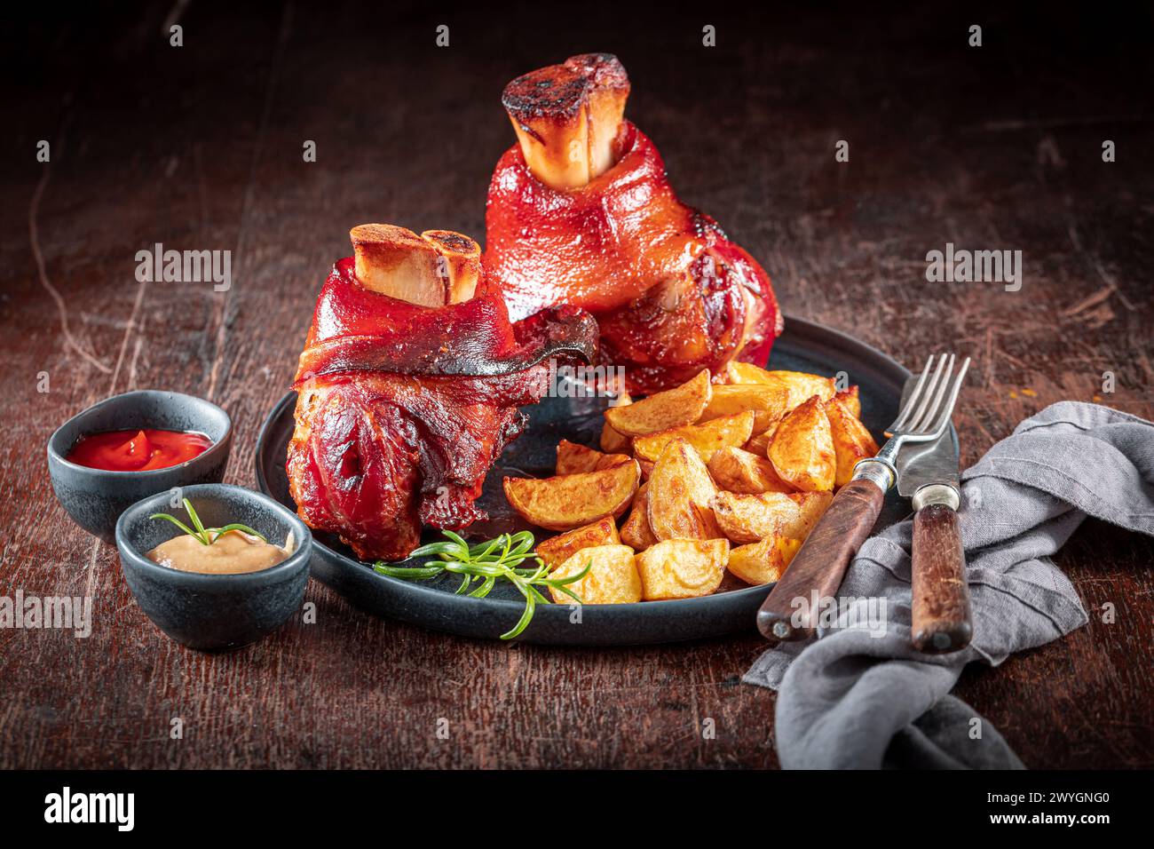 Fresh and cripsy roasted ham hock served with potatoes and pickled ...