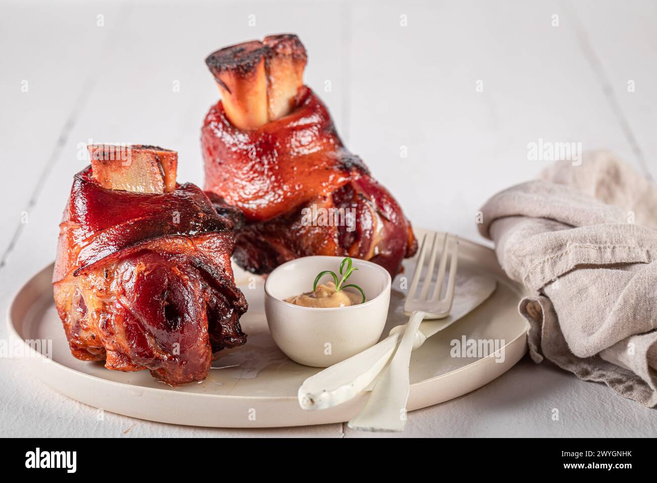 Hot and cripsy roasted ham hock served with sauerkraut and potatoes ...