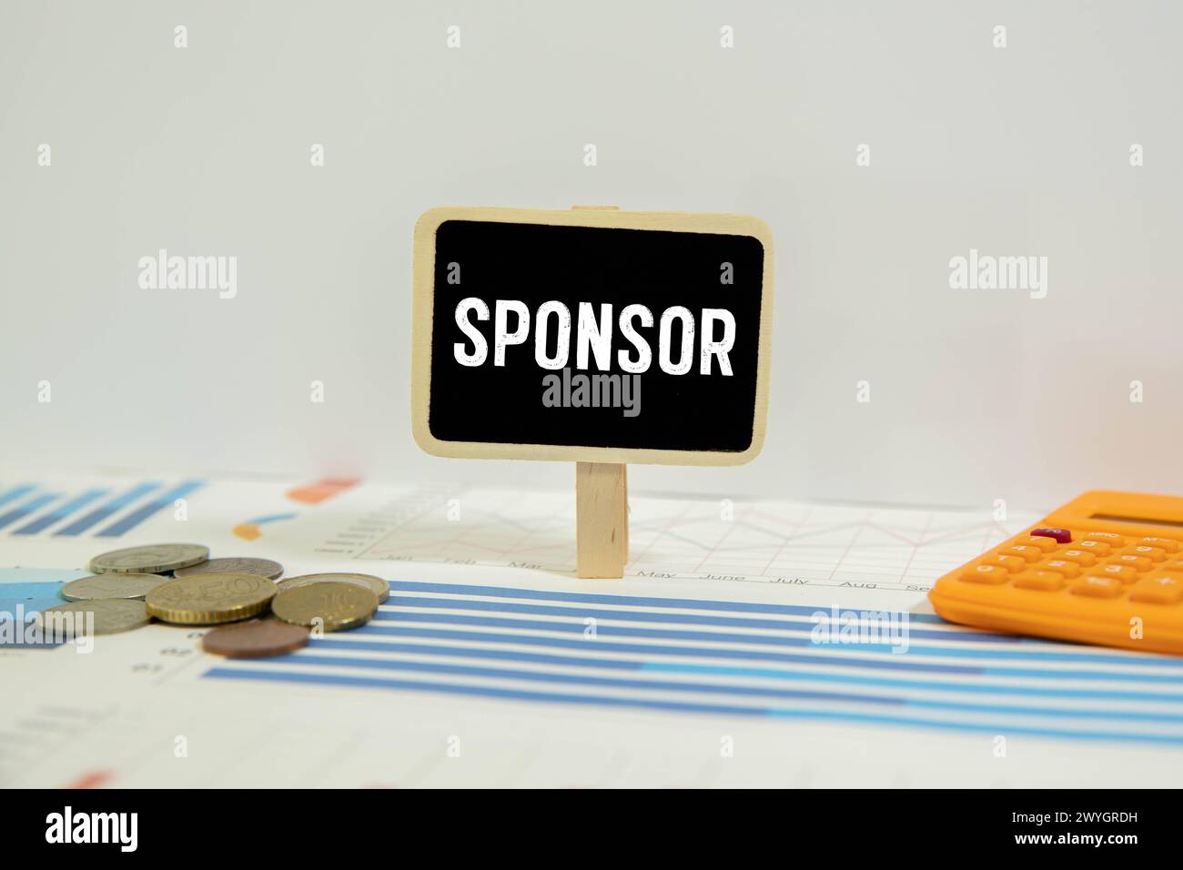 Sponsor concept with hand pressing a button on blurred abstract ...
