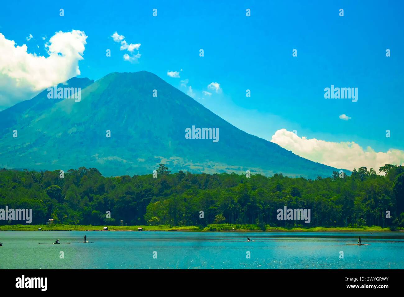 a majestic of Mount Lemongan with a calm lake in front of it. Lush ...
