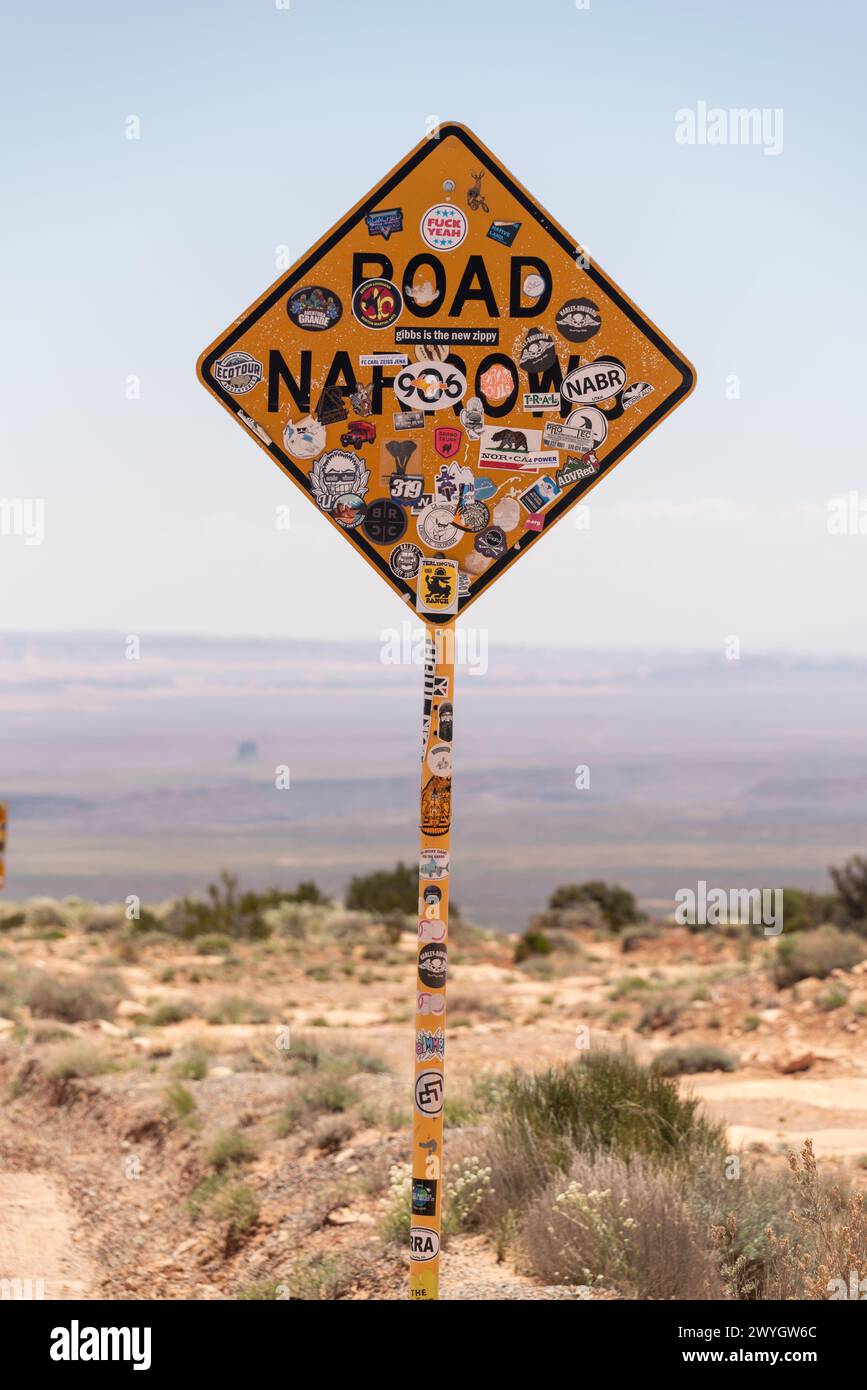 Road sign covered in stickers, Southern Utah Stock Photo - Alamy