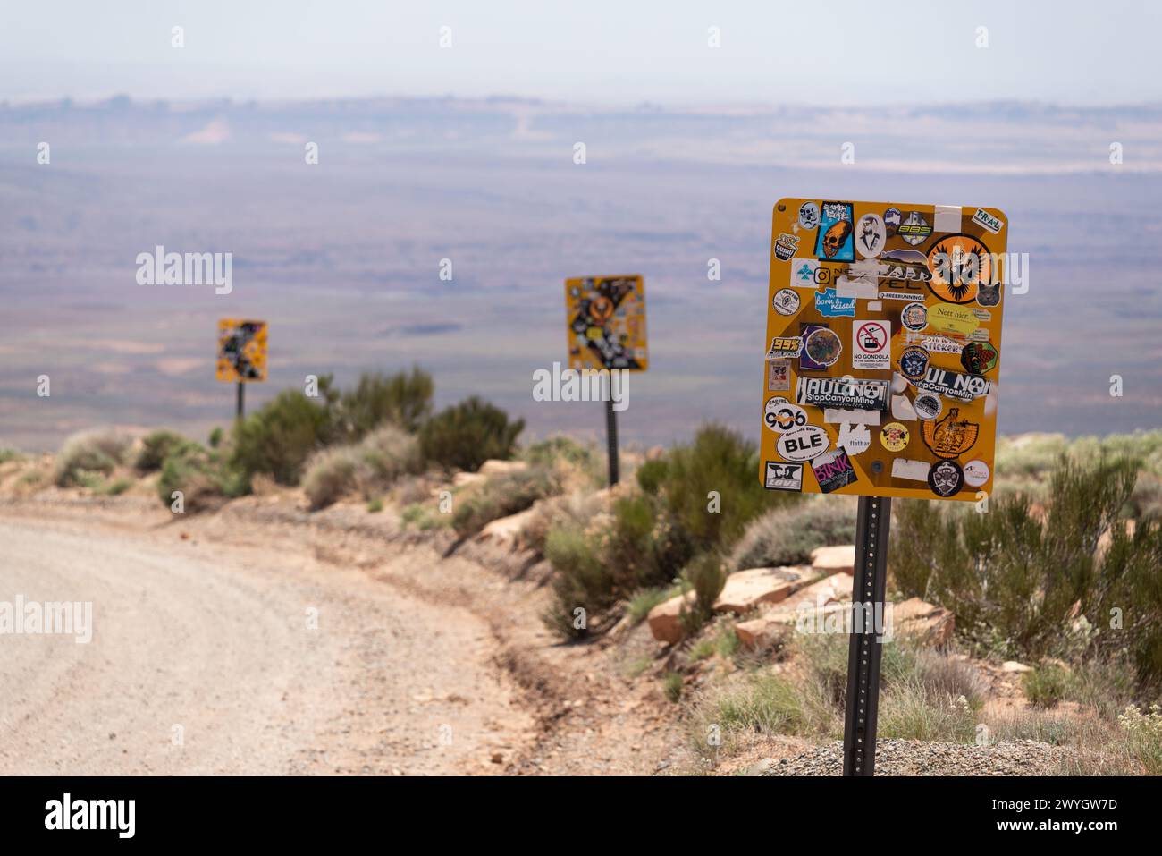 Road sign covered in stickers, Southern Utah Stock Photo - Alamy