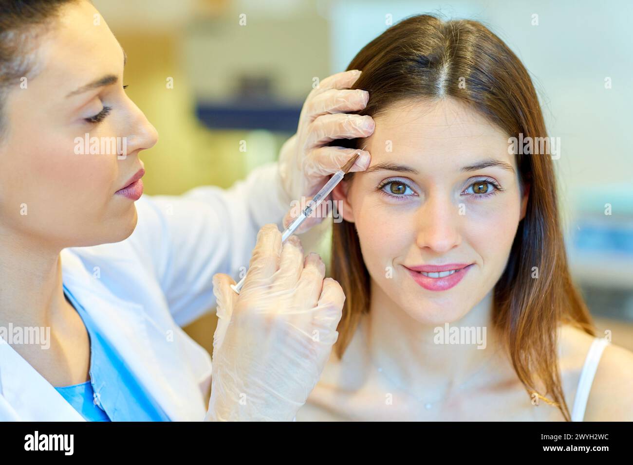 Syringe. Botox, cosmetic medicine. Botulinum toxin treatment involves ...