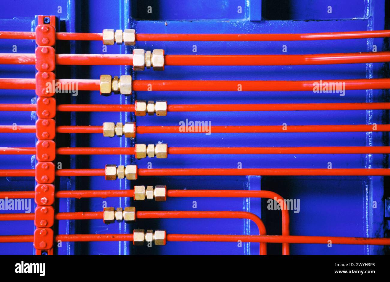 Recycling industry. Hydraulic press at waste sorting plant. Oil pipes ...