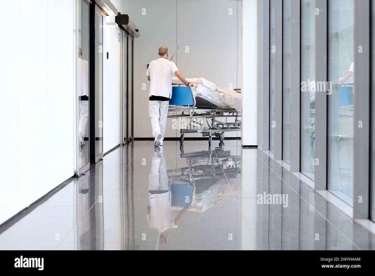 Transferring patient hospital bed hi-res stock photography and images ...