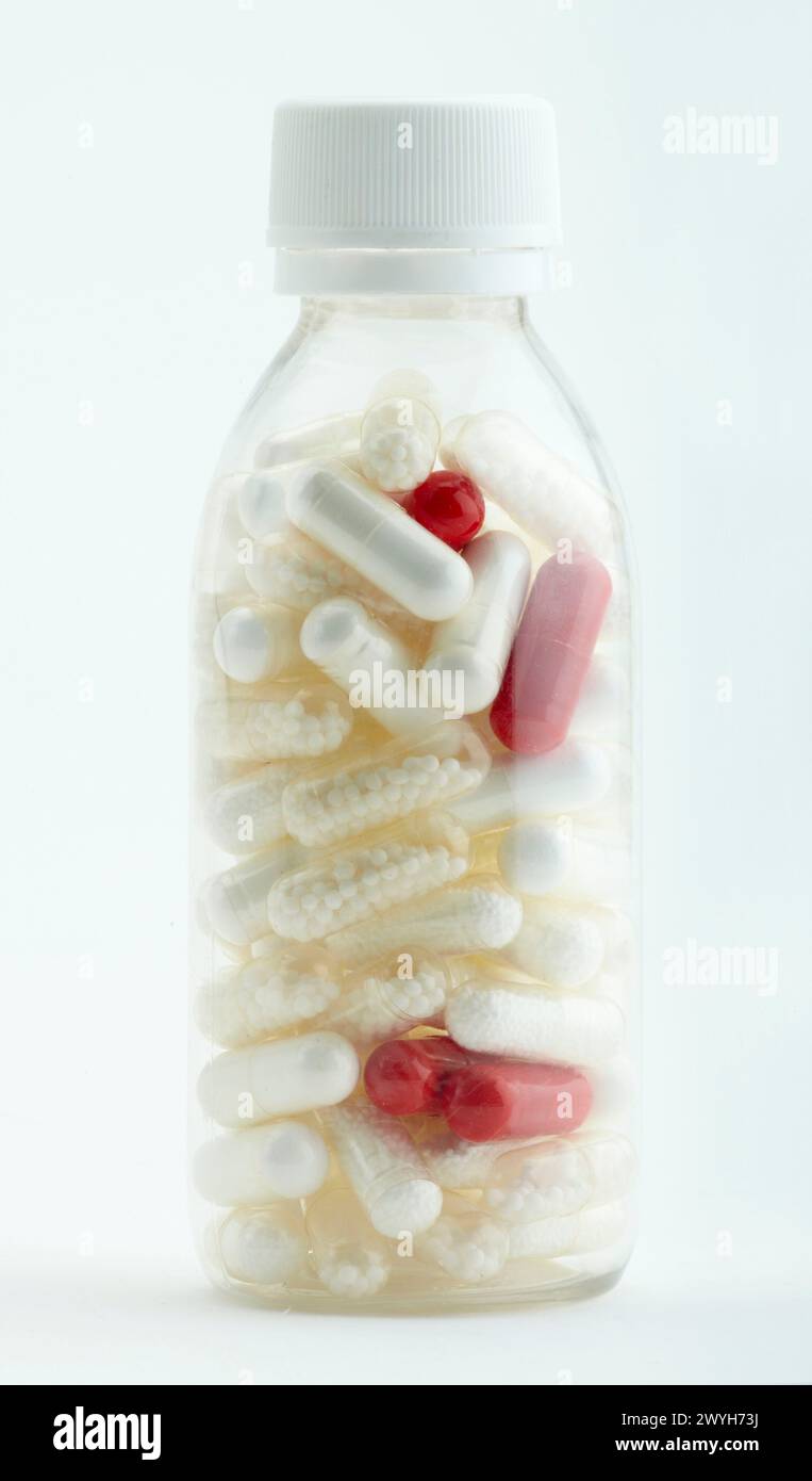 Sample different colored capsules filled with powder and pellets ...