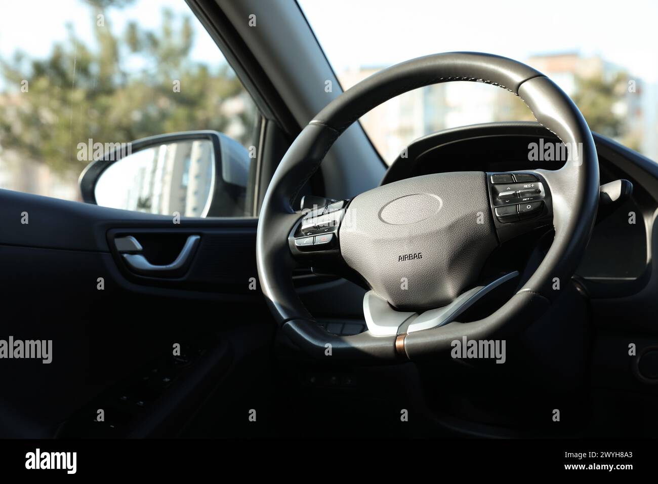 Black steering wheel inside of modern car Stock Photo - Alamy
