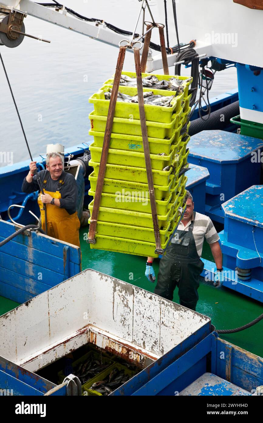 Two fishing boats unloading hi-res stock photography and images - Alamy