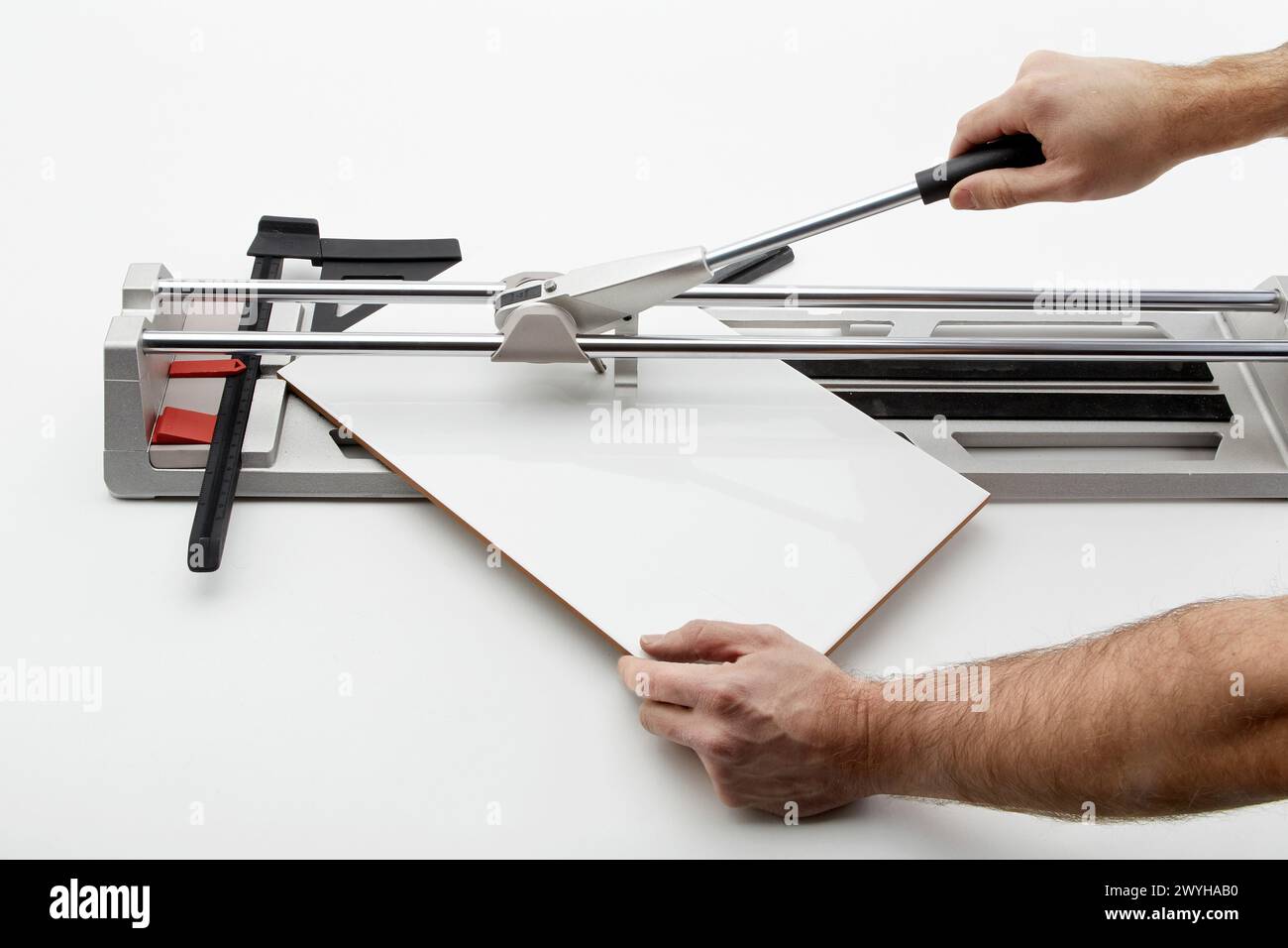 Manual tile cutter. Cutting tile. Construction Industry Stock Photo - Alamy