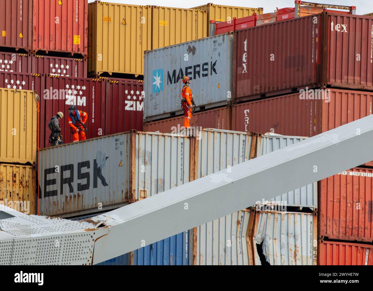 Salvage operators assess damaged containers aboard the Motor Vessel ...
