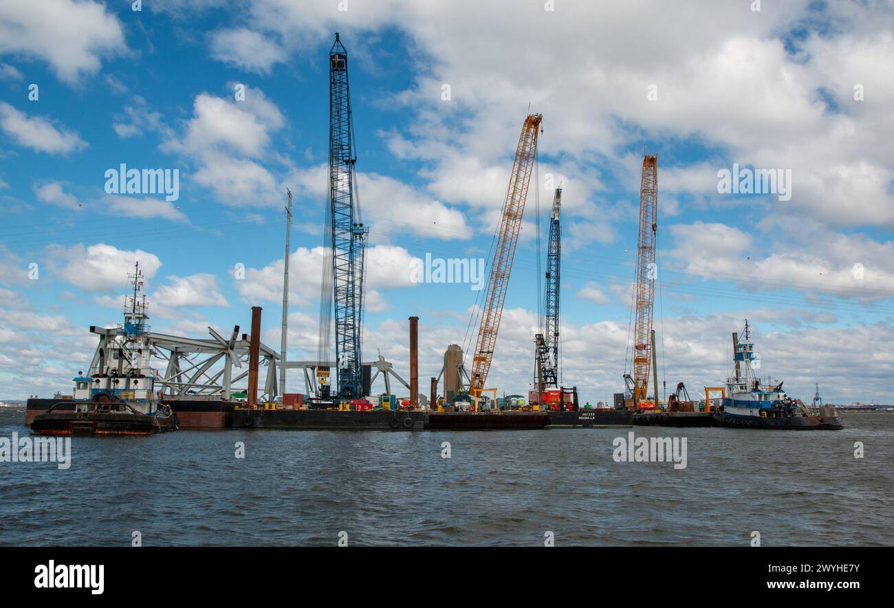 Salvors assemble cranes to aid salvage efforts on April 6, 2024 ...