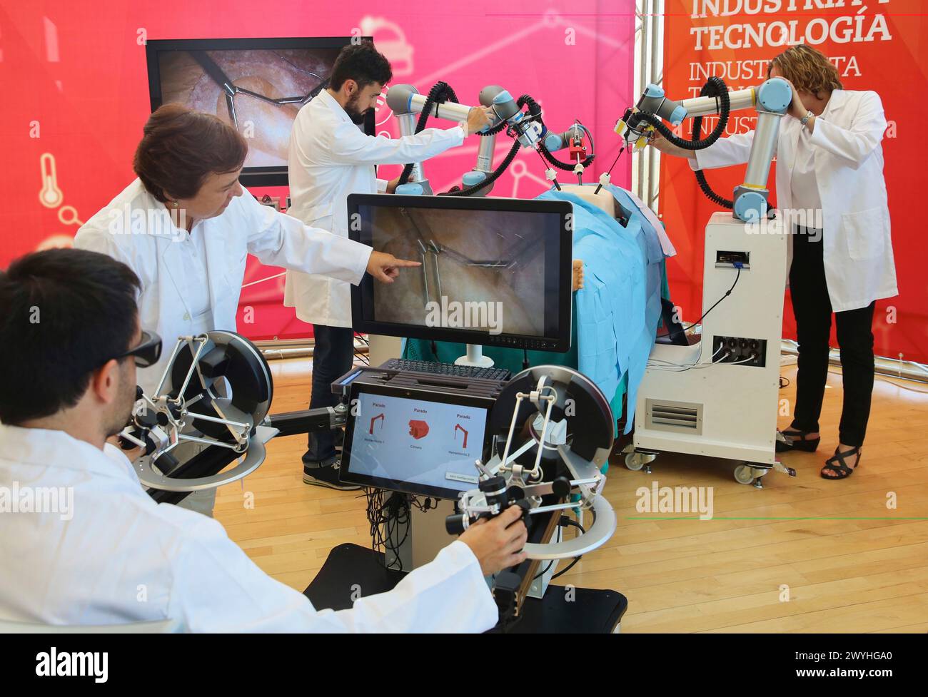 Male engineer controls robotic arm hi-res stock photography and images ...