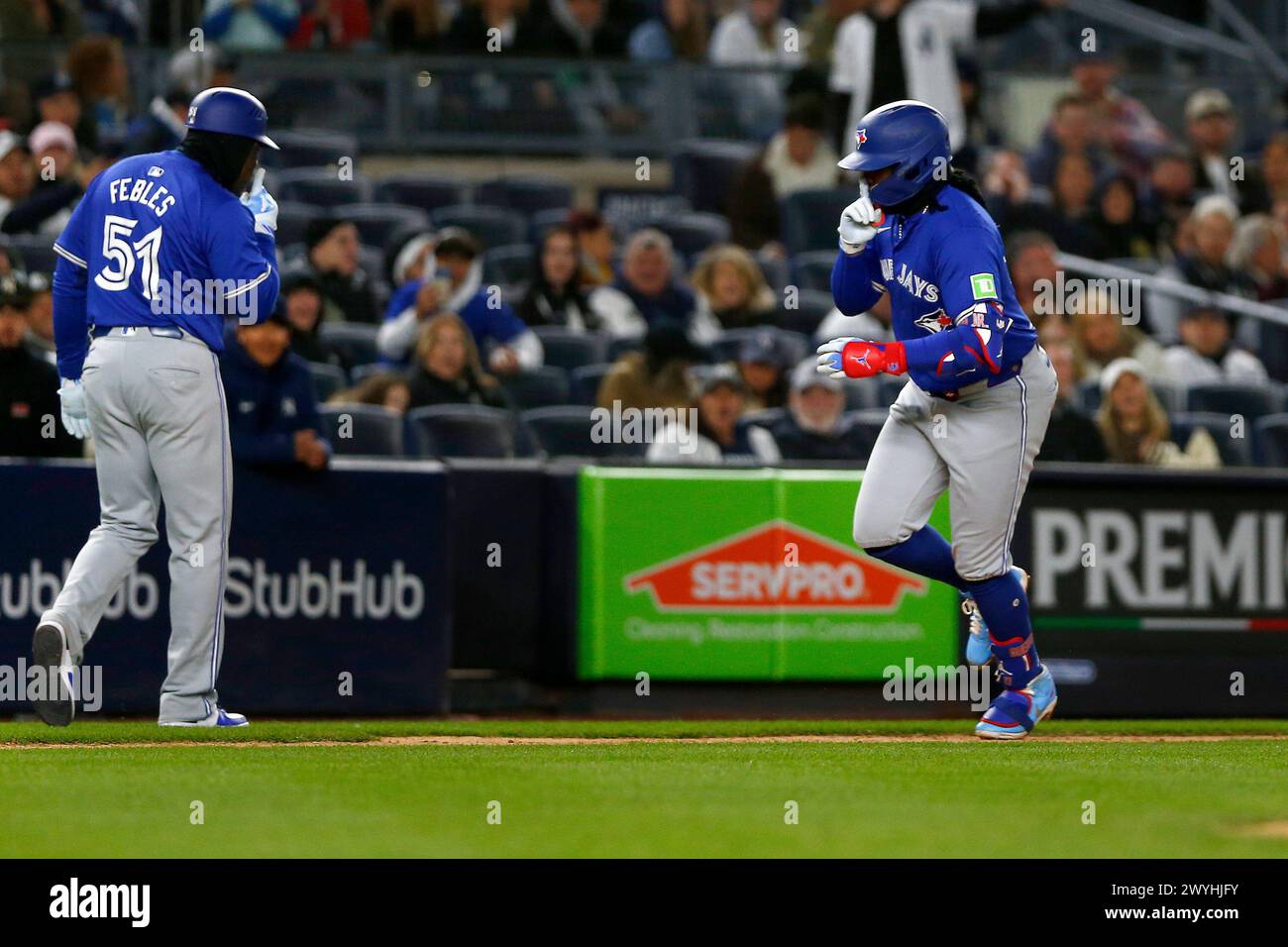 Toronto Blue Jays third base coach Carlos Febles, left, and first ...
