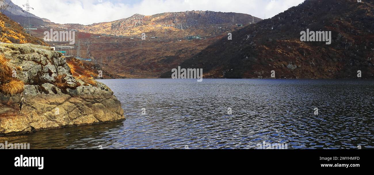scenic view of beautiful changu lake, a popular tourist destination of east sikkim, surrounded ...