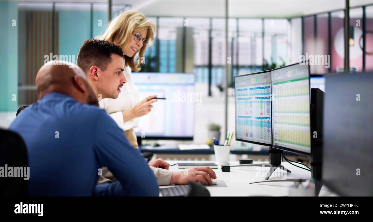 Analyst Employee Working On Spreadsheet Using Desktop Computer Stock ...
