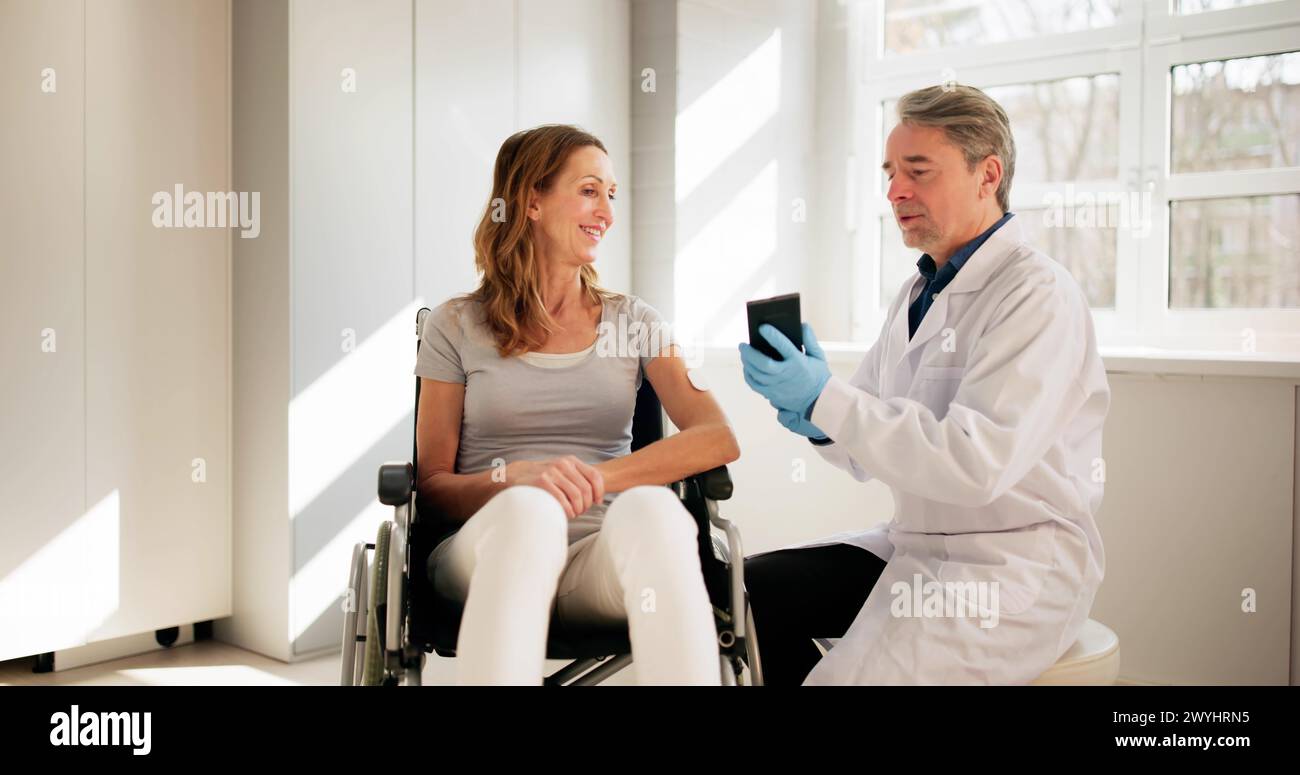 Diabetic Patient And Continuous Blood Sugar Level Monitor Stock Photo ...