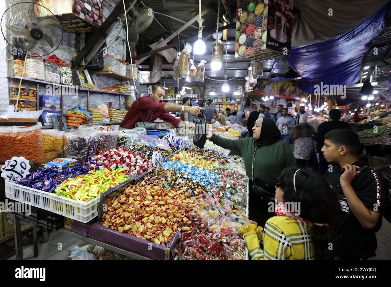 Amman, Jordan. 6th Apr, 2024. People buy sweets ahead of Eid al-Fitr ...