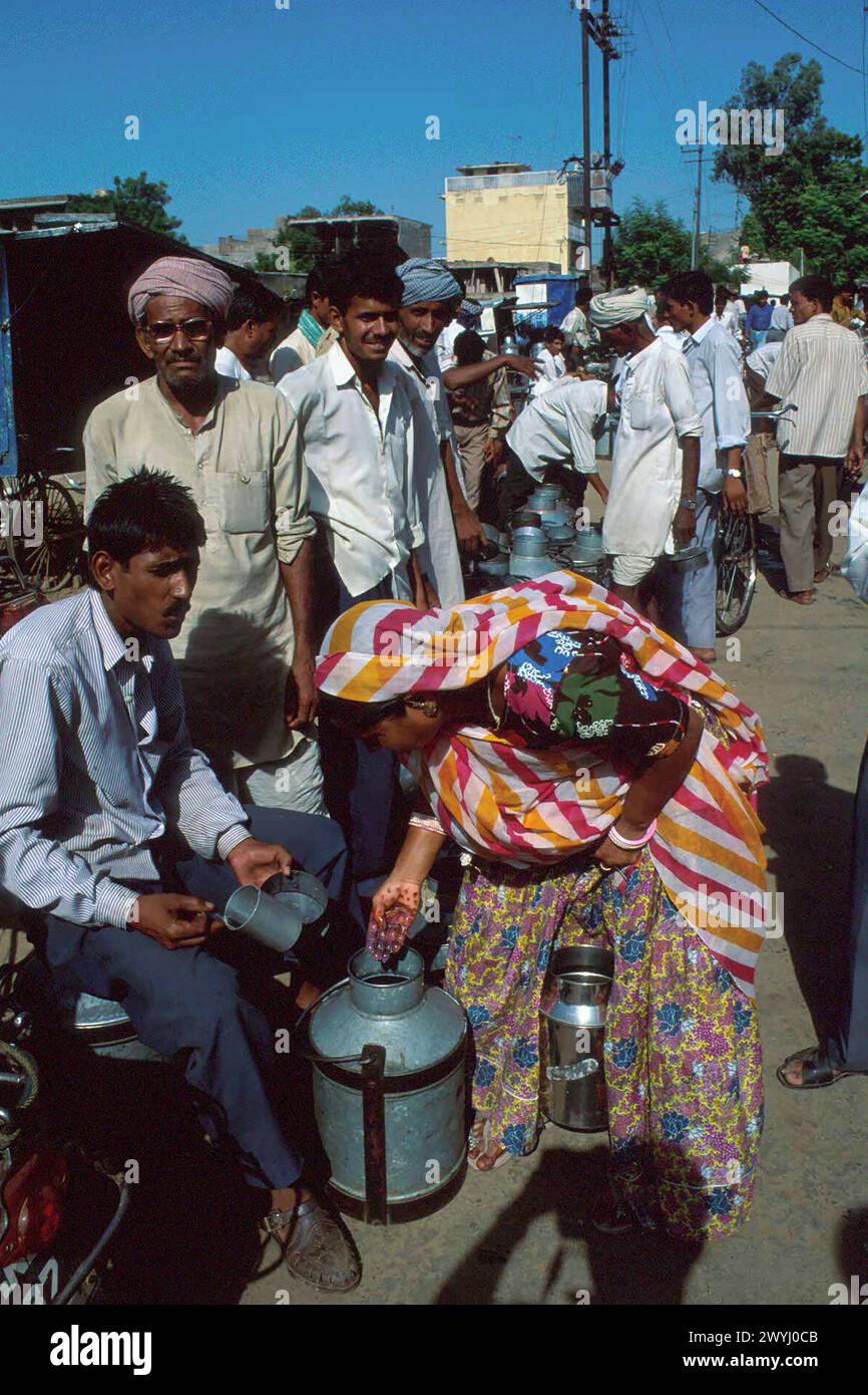Woman with painted hands testing milk, Milk market, taken in 1999 ...