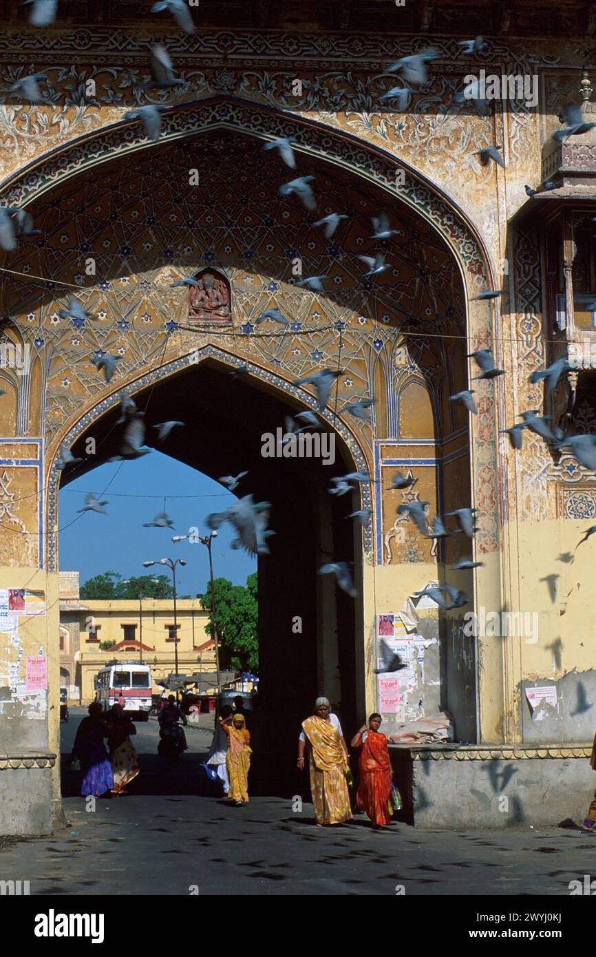 Women walking through gate with pigeons, Naqqar Darwaza Gate, taken in ...