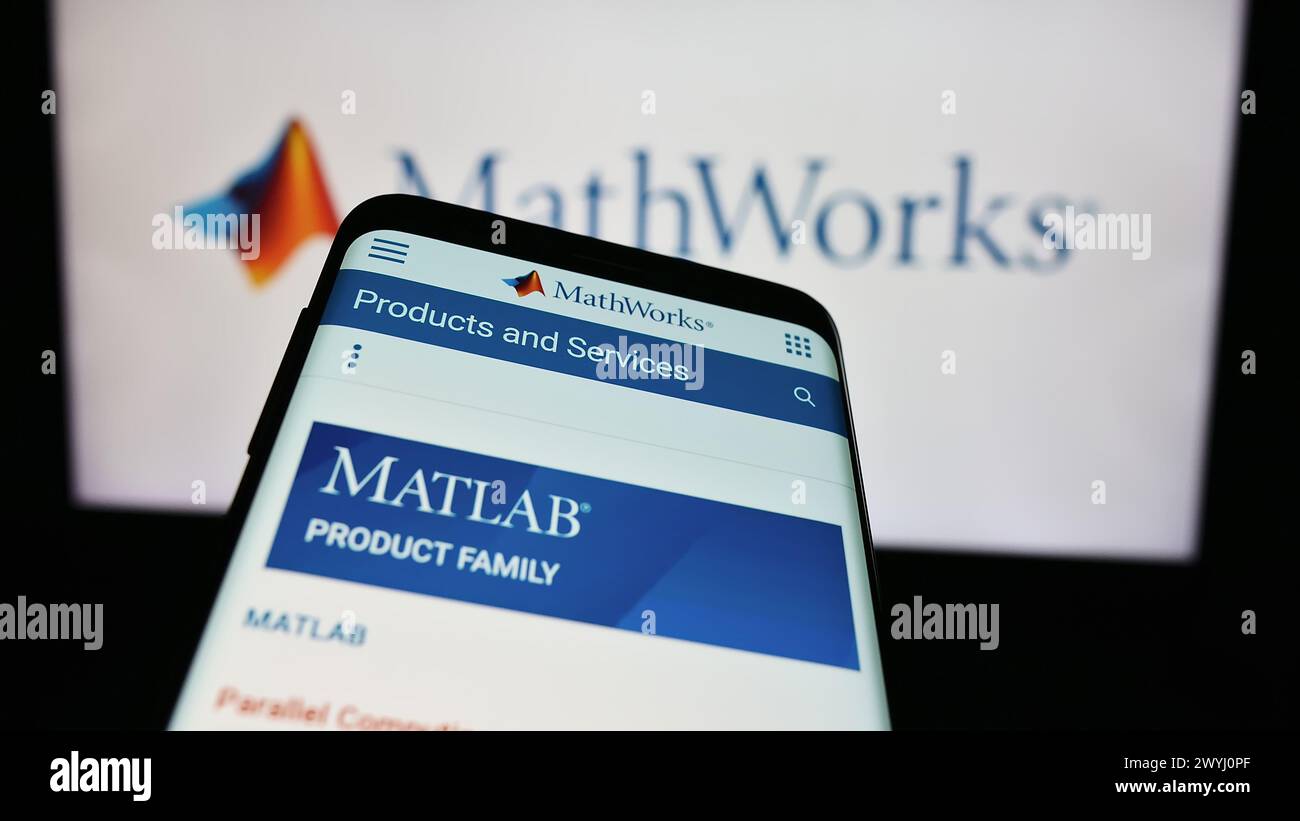 Mobile phone with website of US computing software company The MathWorks Inc. in front of ...