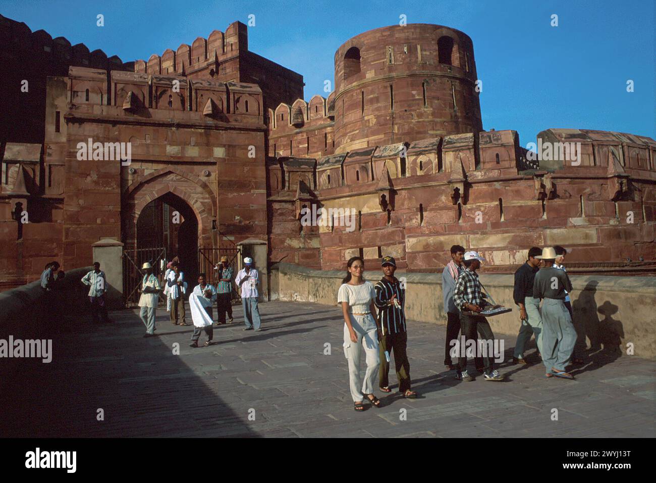 Female Asian tourist with souvenir sellers on entranceway, Red Fort ...
