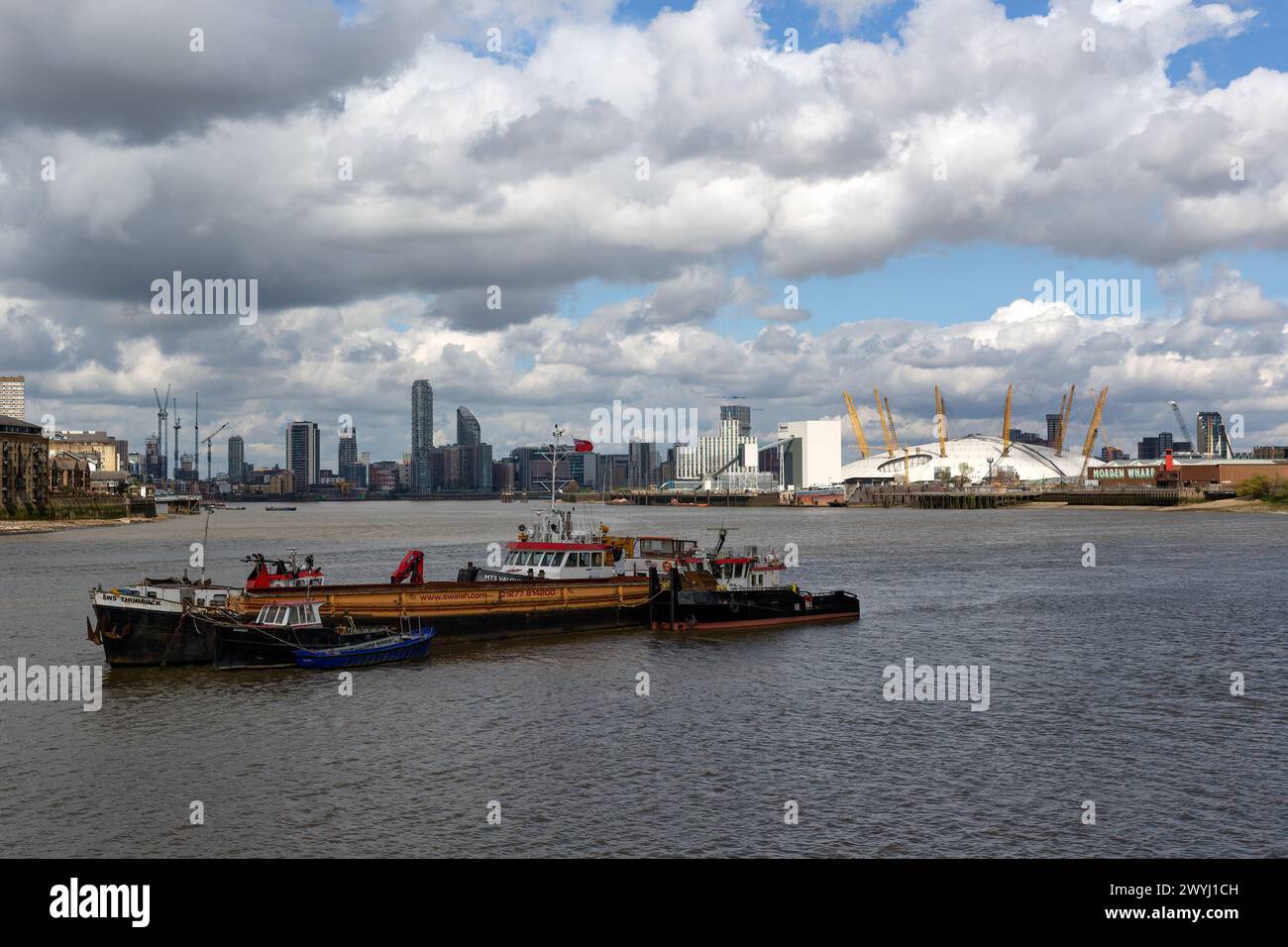 LONDON, UK - APRIL 02, 2024: Working boats on the River Thames with the ...