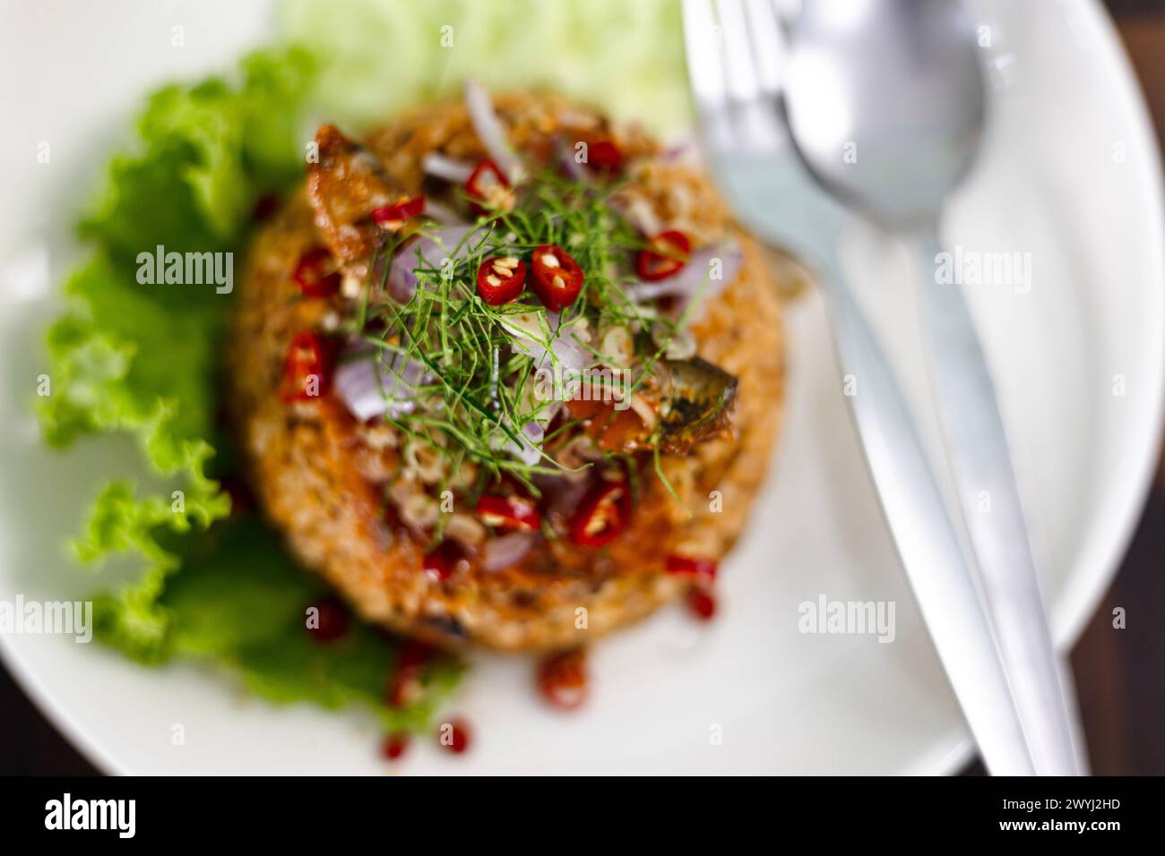 Thai food, Fried jasmine rice with canned fish mackerel in tomato sauce ...