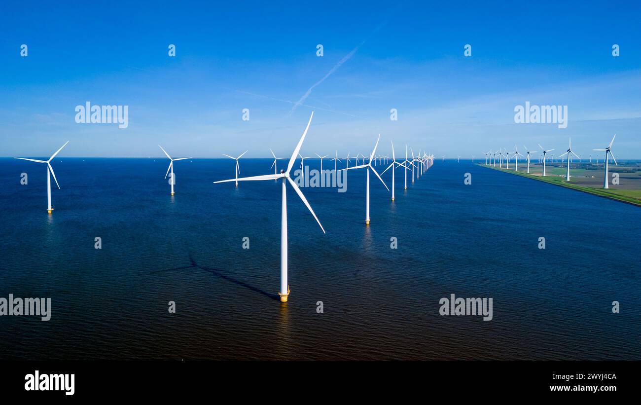A stunning scene of countless windmills standing tall in a vast body of ...