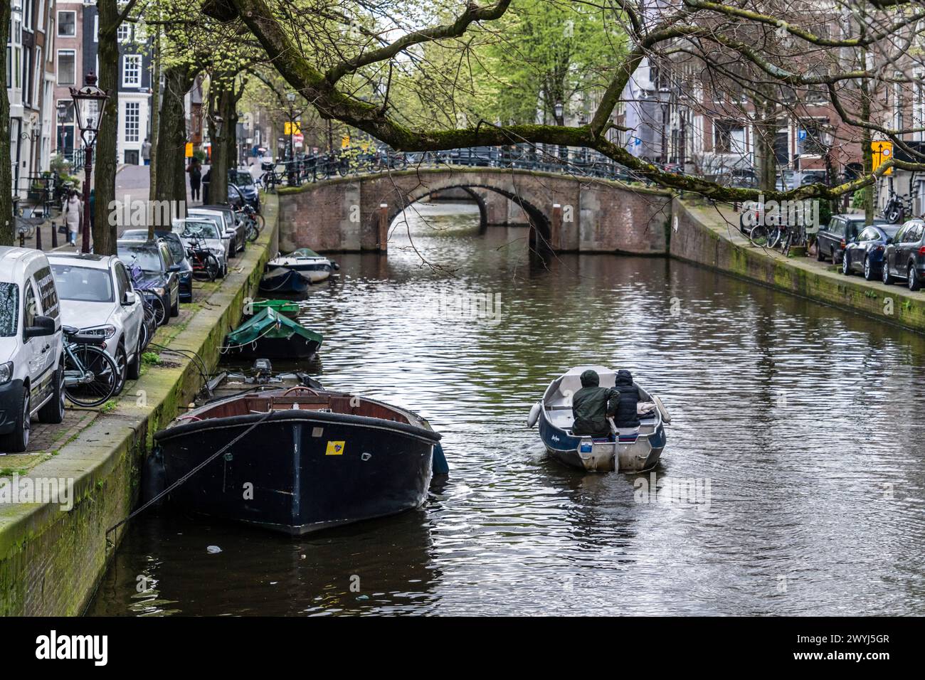 Gondola crossing small canal hi-res stock photography and images - Alamy