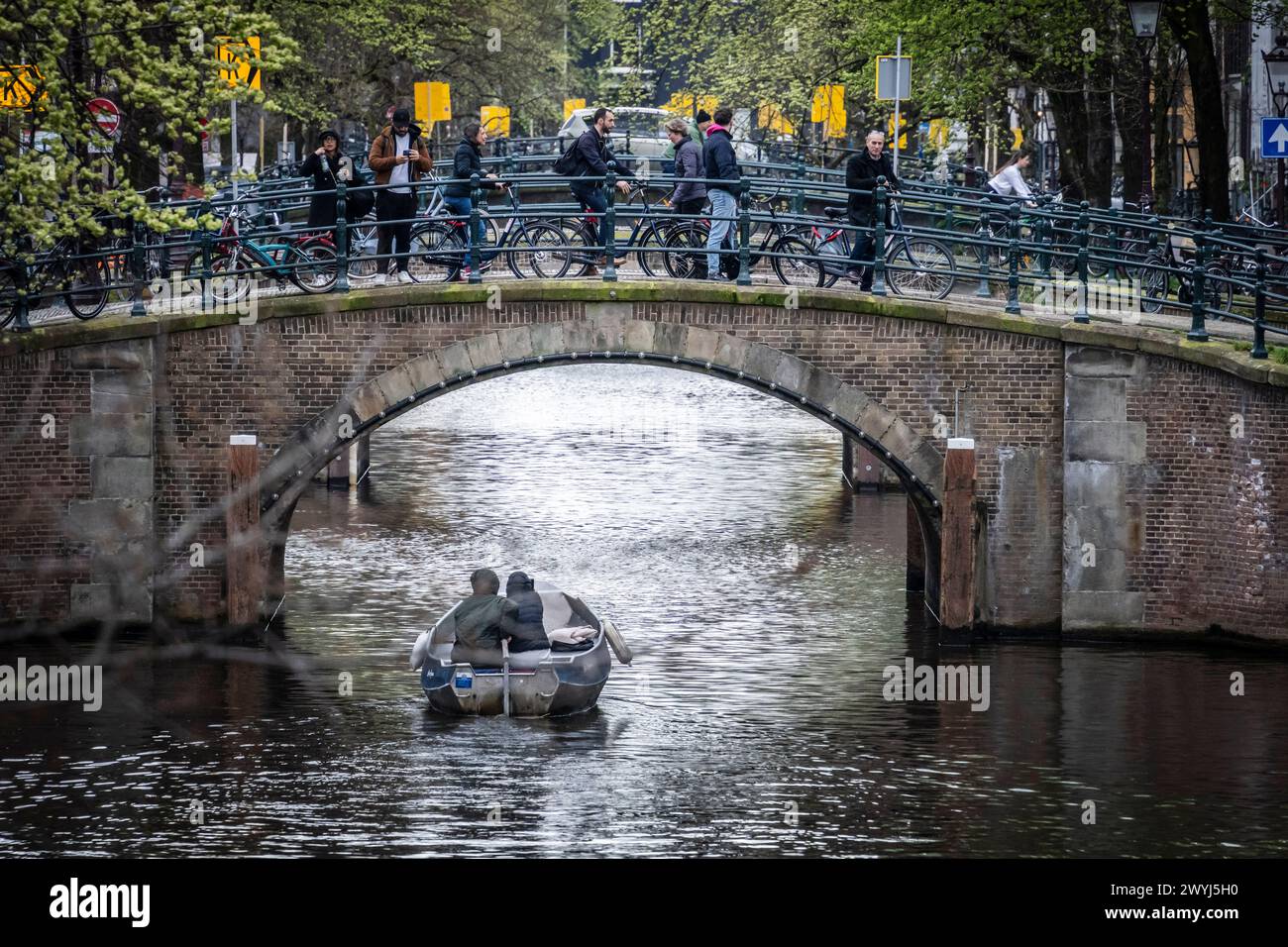 Gondola crossing small canal hi-res stock photography and images - Alamy