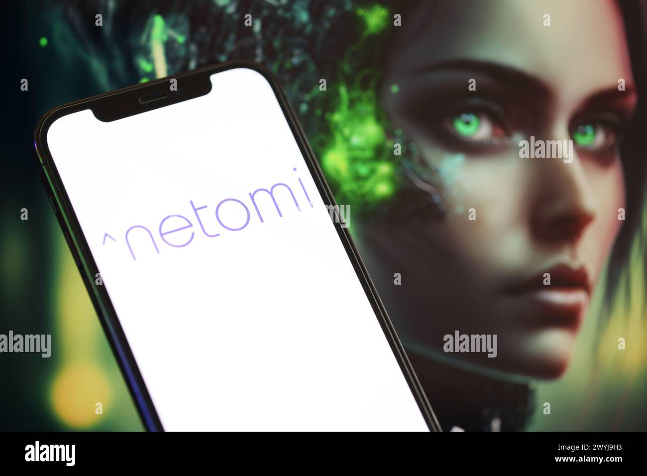 KYIV, UKRAINE - MARCH 17, 2024 Netomi logo on iPhone display screen with background of ...