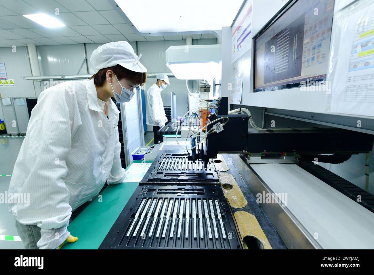 HAIAN, CHINA - APRIL 7, 2024 - A skilled worker is producing consumer ...