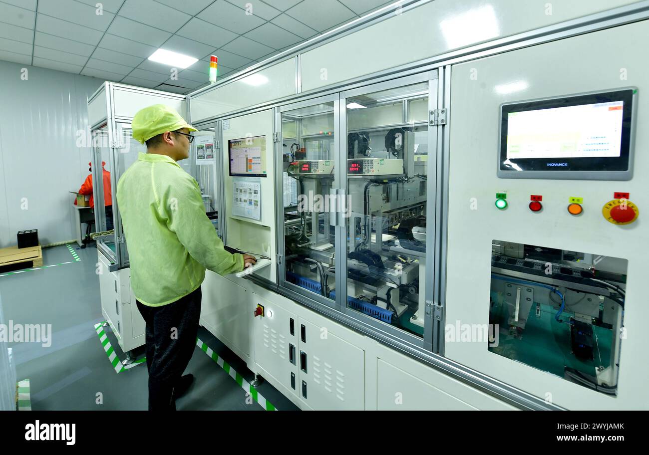 HAIAN, CHINA - APRIL 7, 2024 - A skilled worker is producing consumer lithium batteries at an ...