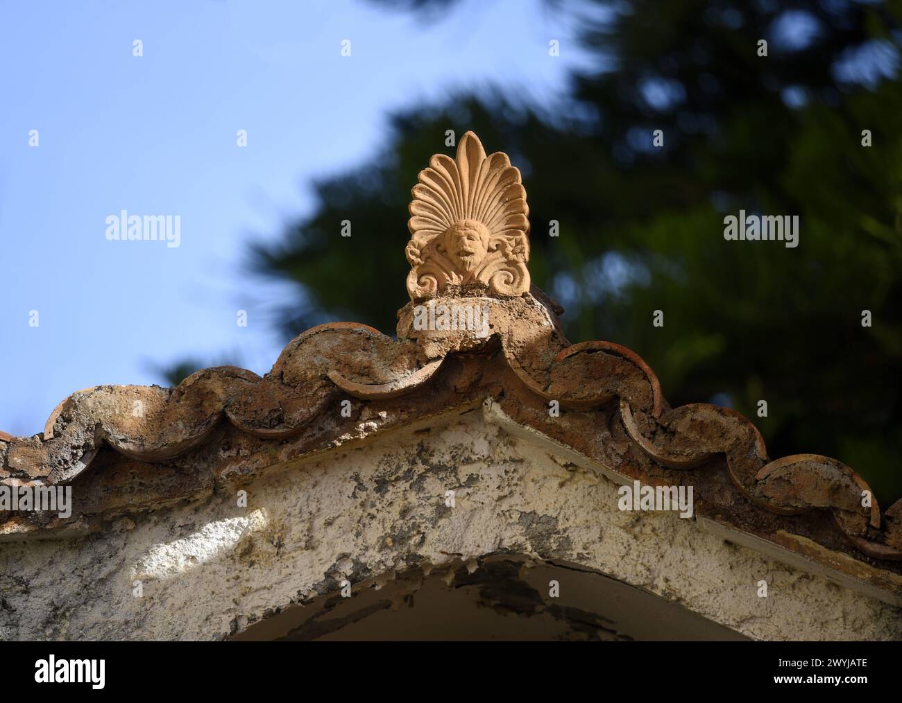 Antique clay Antefix on a clay tile rooftop in Kalamata, Peloponnese ...