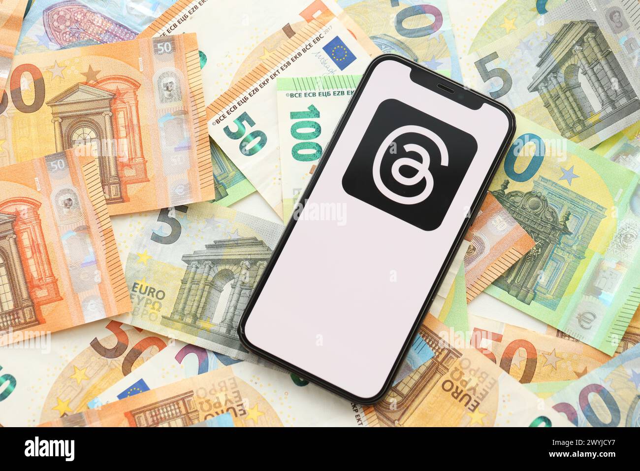 KYIV, UKRAINE - APRIL 1, 2024 Threads icon on smartphone screen on many ...