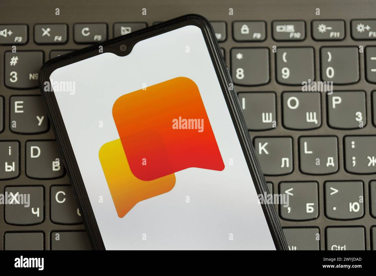 KYIV, UKRAINE - APRIL 1, 2024 Helo icon on smartphone screen on black ...