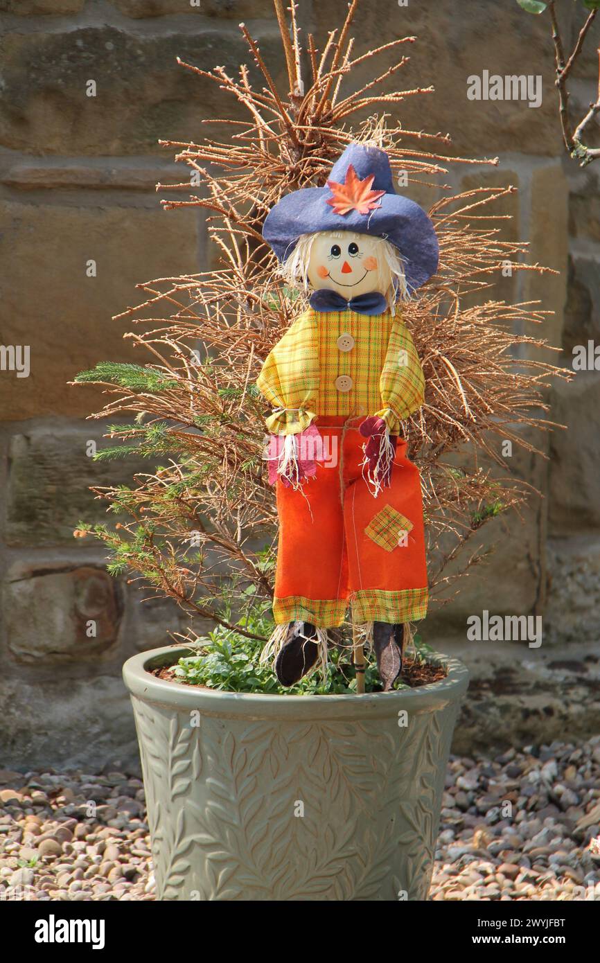 A Pretty Rag Doll Standing in a Large Flower Pot Stock Photo - Alamy