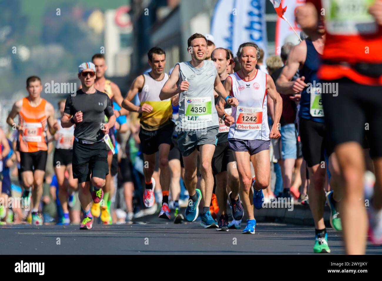 linz, austria, 07 april 2024, competitors of the linz marathon crossing ...