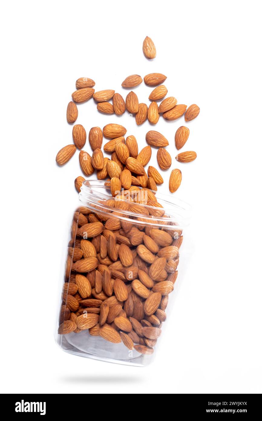 Almonds falling from bowl hi-res stock photography and images - Alamy