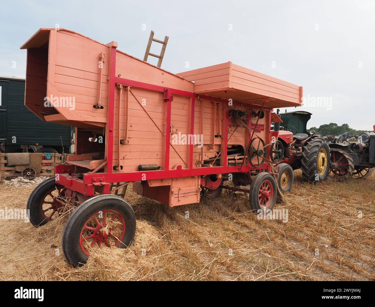 a vintage threshing machine seen at a display Stock Photo - Alamy