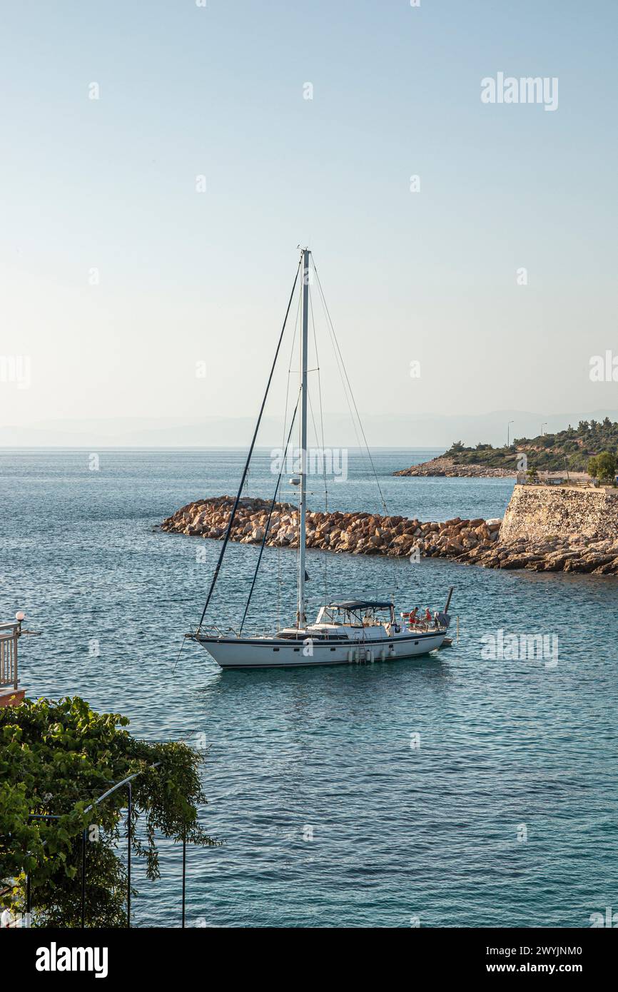 Small boats and yachts docked on the marina park with oceanfront view ...